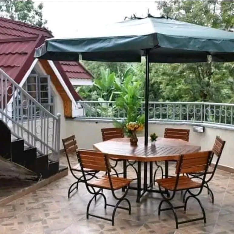 Outdoor Patio Setup – Umbrella Tent, Round Table & Six Chairs | Expert ...
